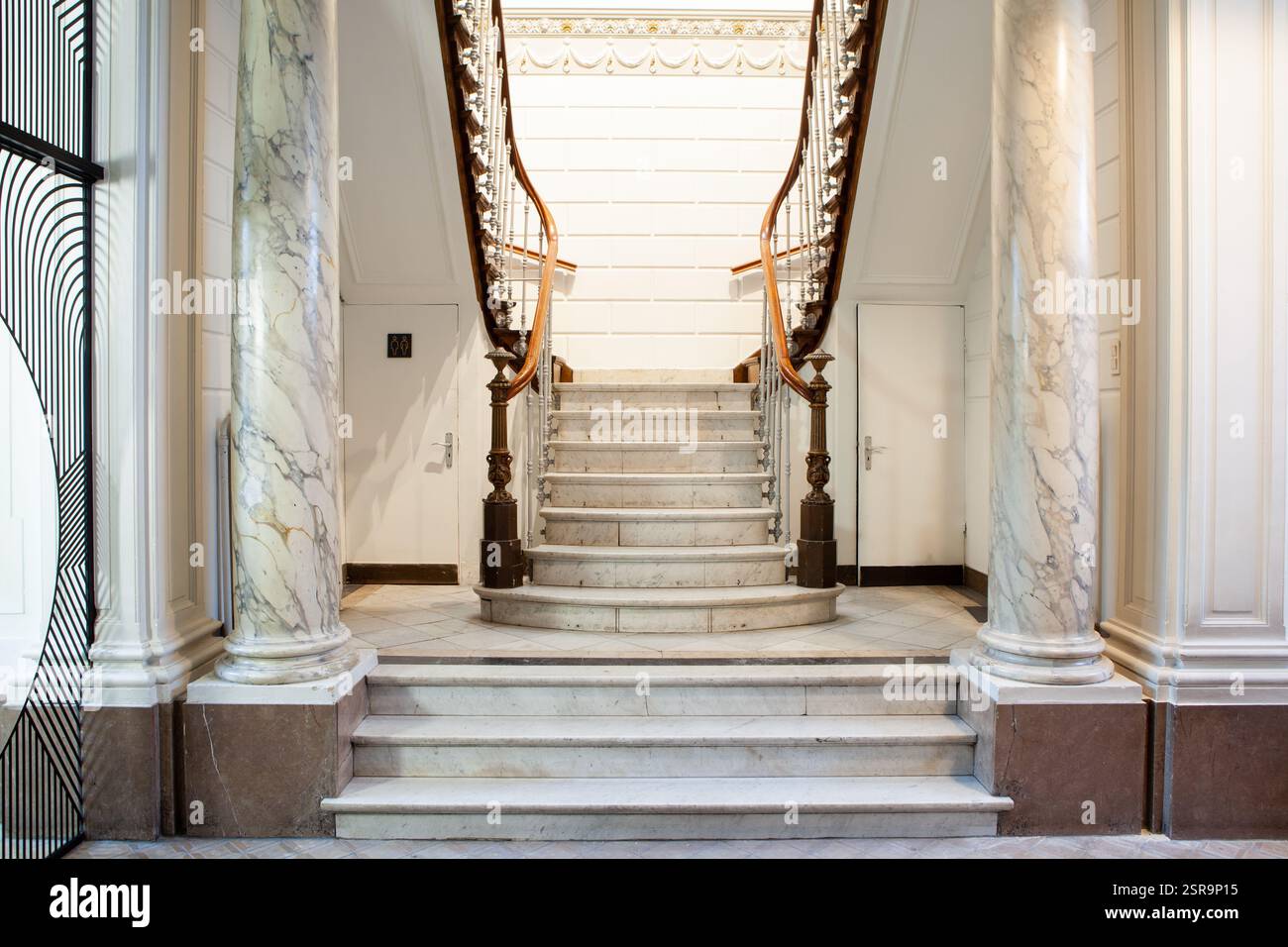 This marble staircase that splits in two in an old mansion Stock Photo ...