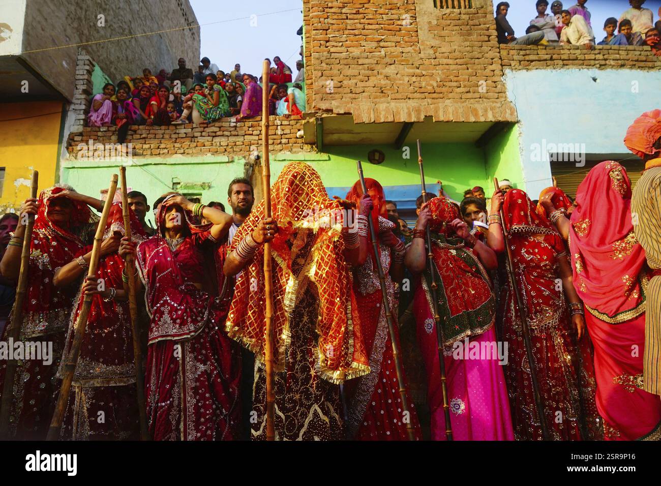 Women with sticks, Lathmar Holi festival, Mathura, Uttar Pradesh, India ...