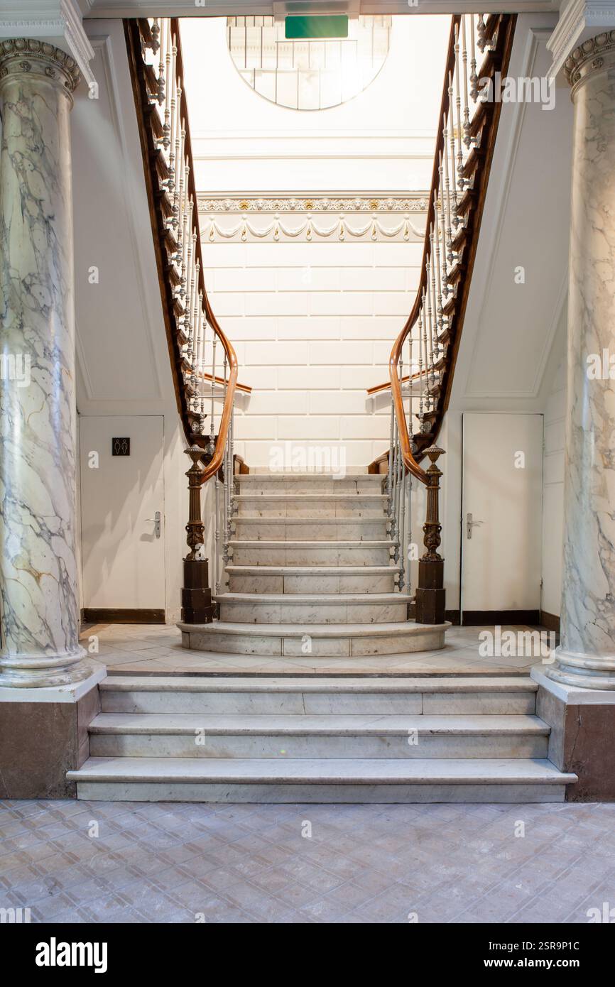 This marble staircase that splits in two in an old mansion Stock Photo ...