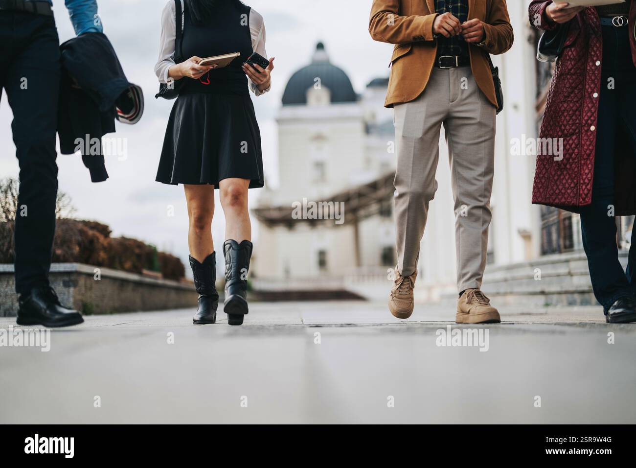 Business people walking in urban city environment outdoors Stock Photo ...