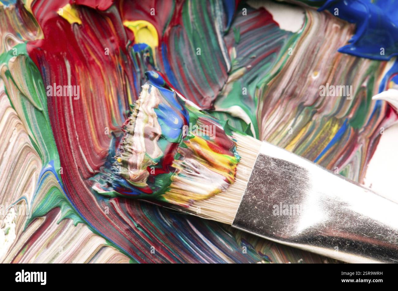 Brush mixing paint on palette, poland Stock Photo - Alamy