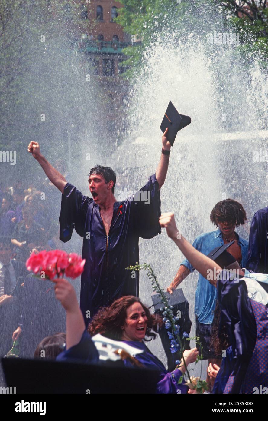 New York University graduation in Washington Square Park. Exuberant ...