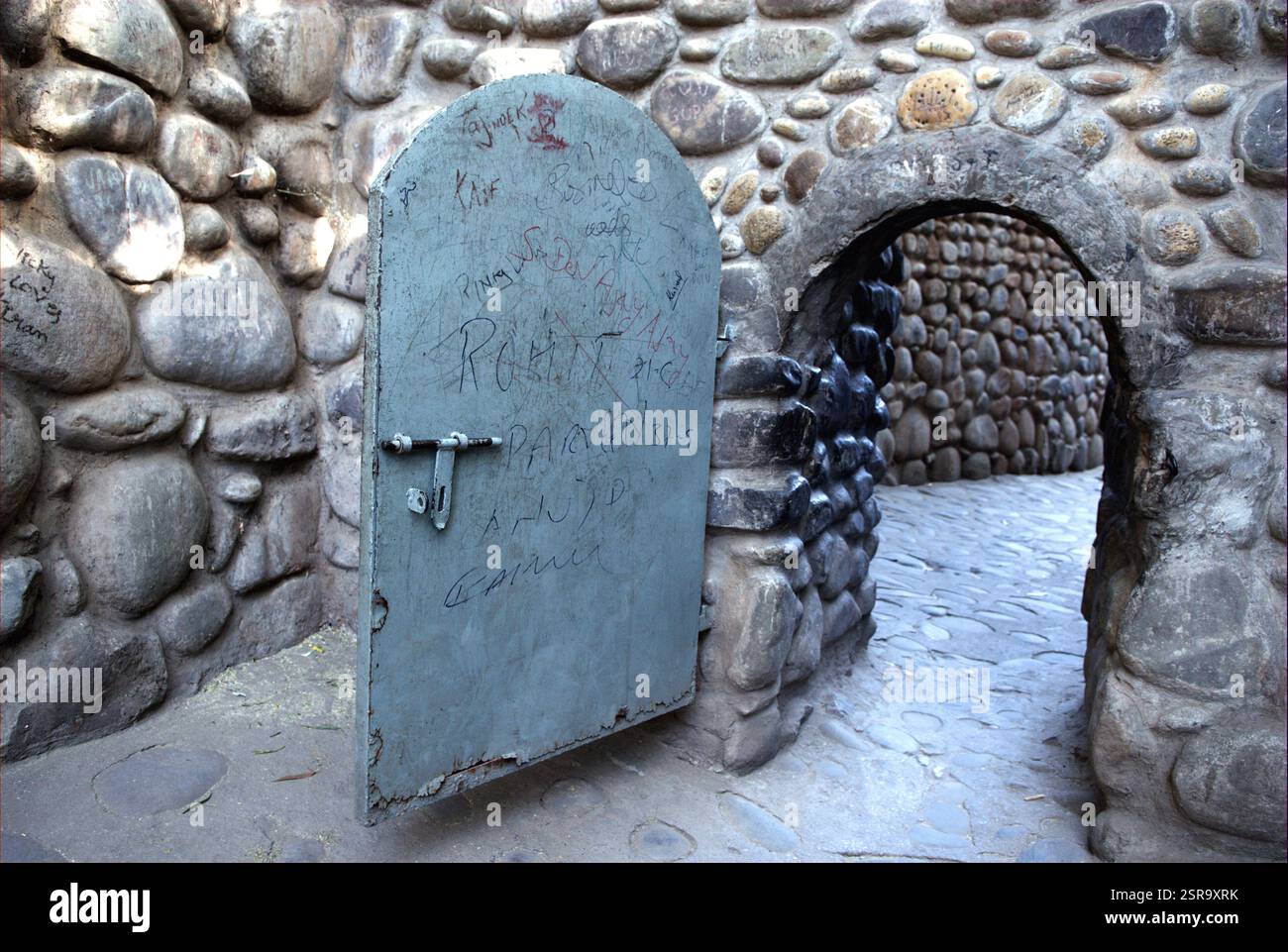 Entry gate wall made of small and big rocks at Rock garden in ...