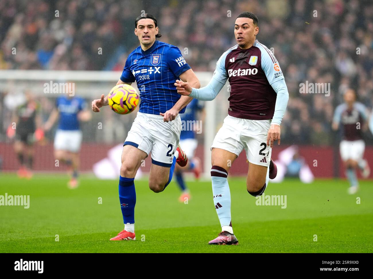 Aston Villa's Morgan Rogers (right) and Ipswich Town's Jacob Greaves ...