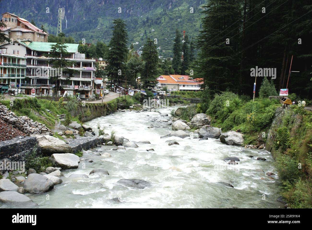 River beas flowing and club house in background, Manali, Himachal ...