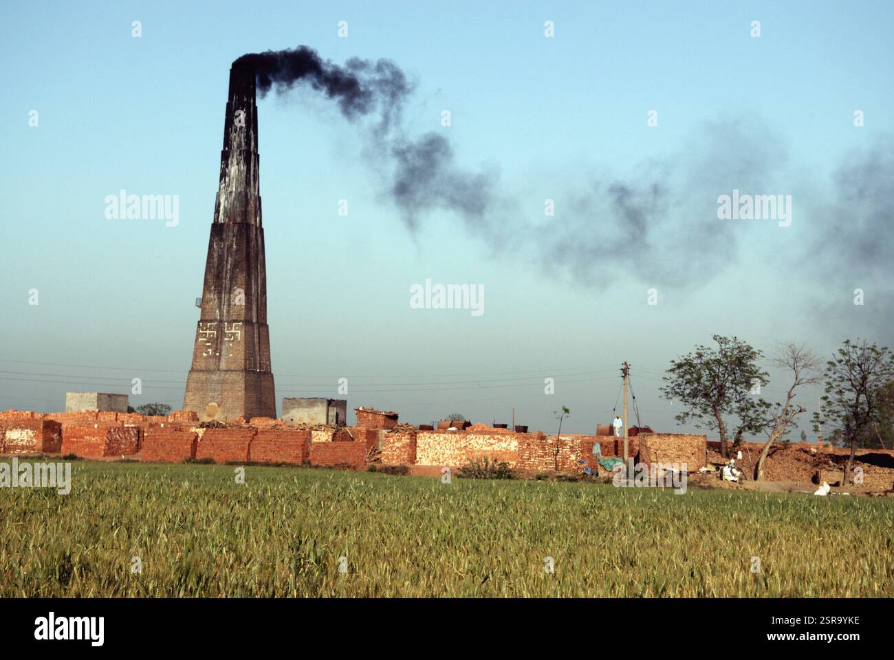 Chimney emitting smoke at brickyard in Doulo Nangal village in Amritsar ...