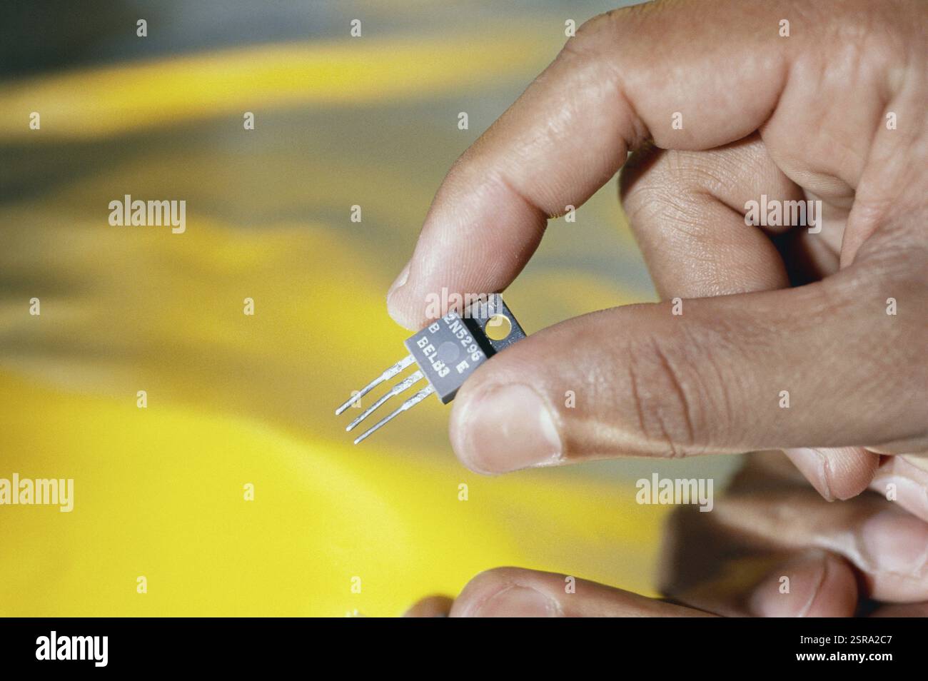 Finger holding semi conductor transmitter, India, Asia Stock Photo - Alamy