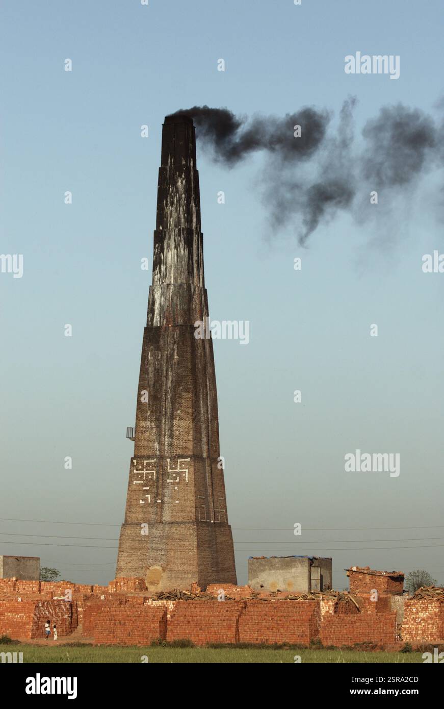 Chimney emitting smoke at brickyard in Doulo Nangal village in Amritsar ...