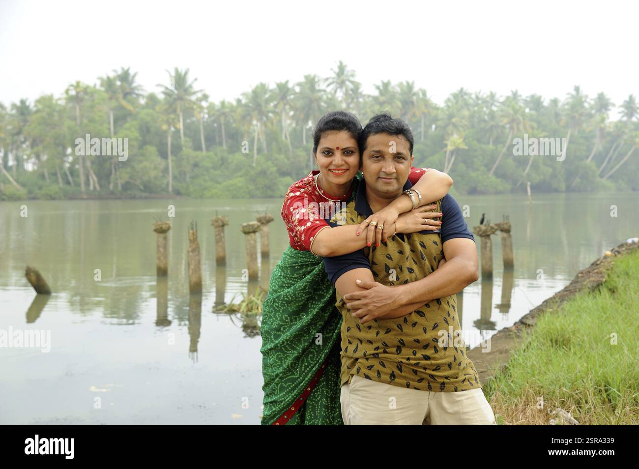 Woman hugging man behind, Kerala, India, Asia, MR#801B, MR#802B, Asia ...