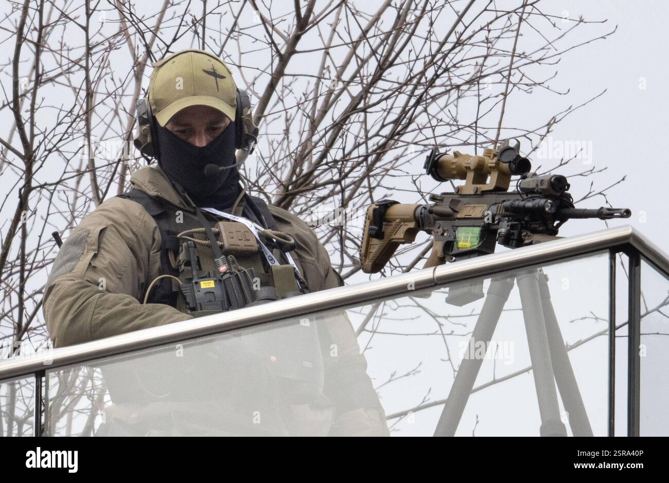Munich, Germany. 15th Feb, 2025. A police sniper secures the area ...
