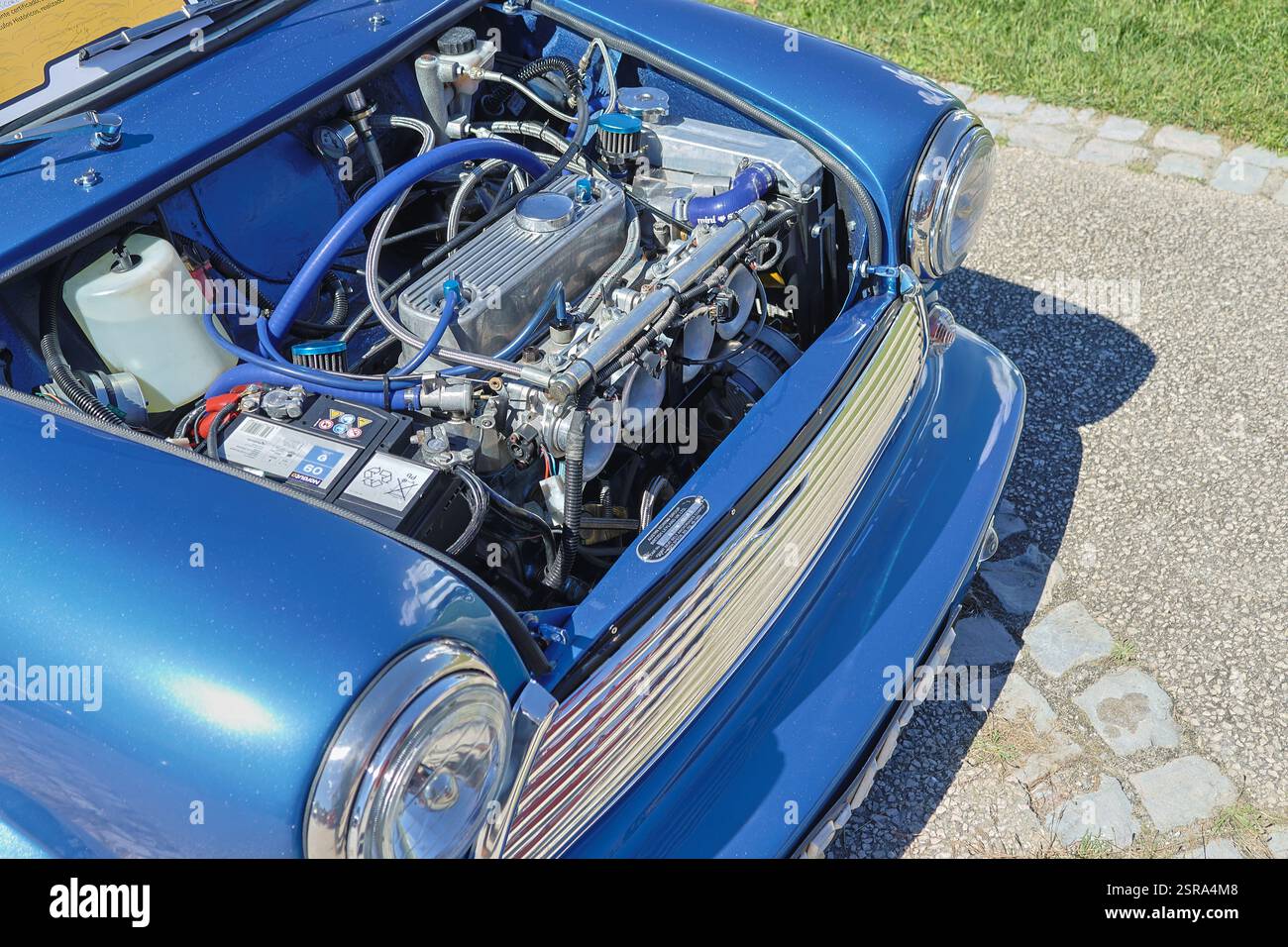 Classic mini cooper with open hood showing a powerful and customized ...