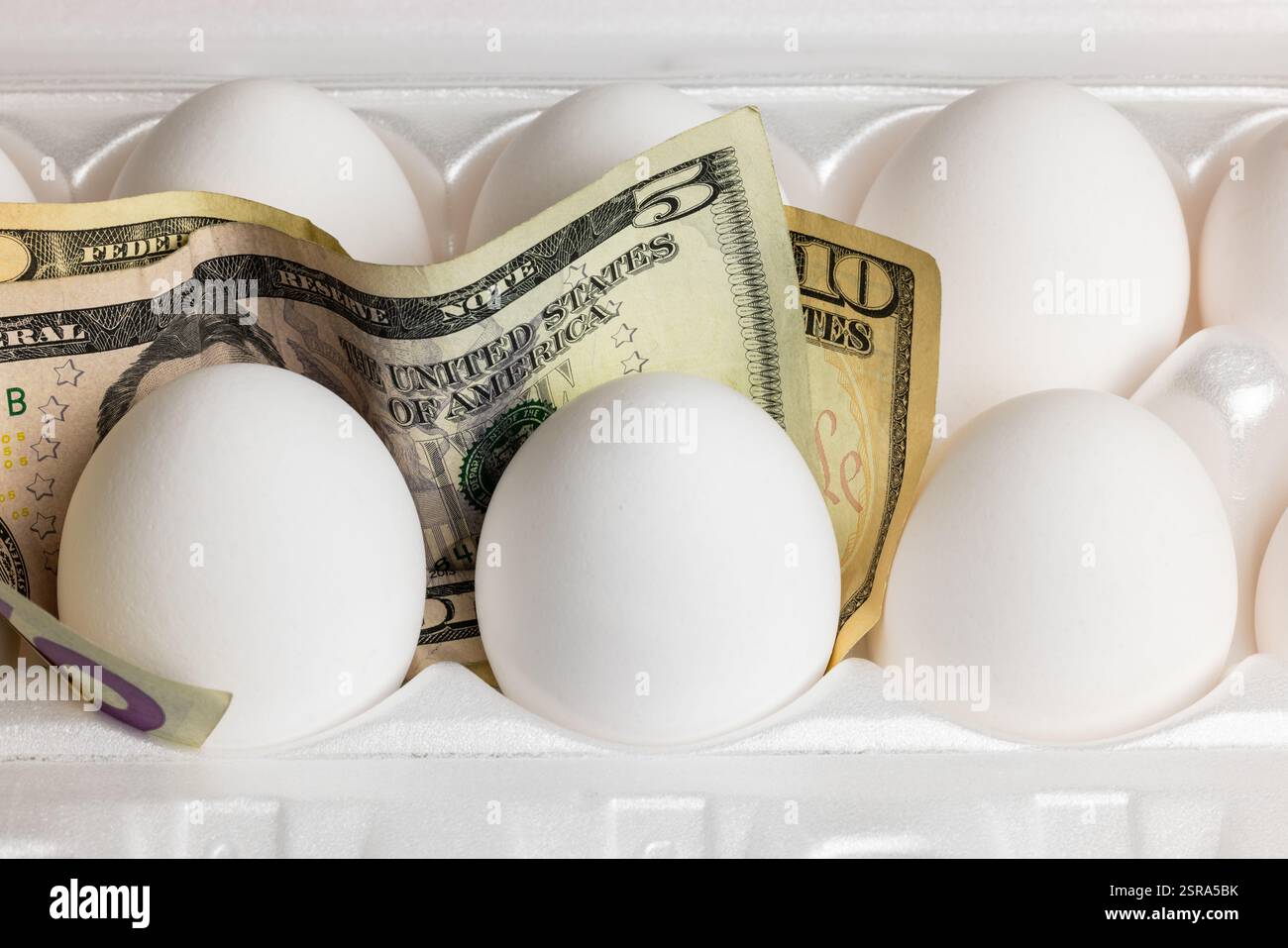 Egg Money - Five and Ten Dollar Bills In A Carton Of Eggs Stock Photo ...