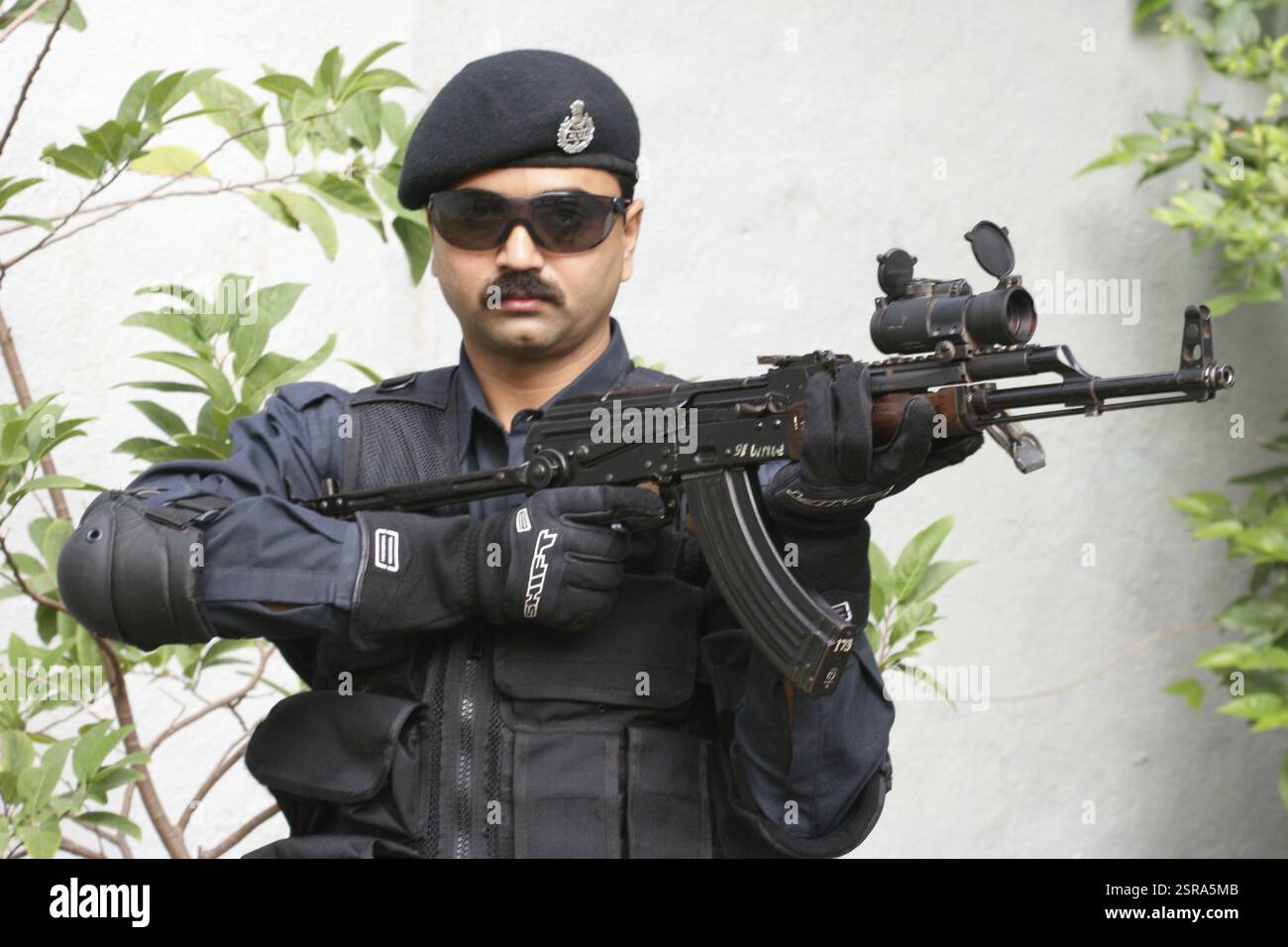 Black Cat commando with an AK 47 light machine gun MR#725 Stock Photo ...