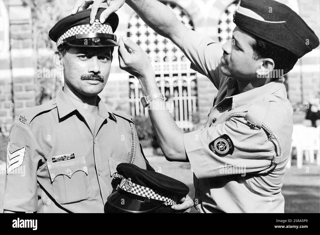 Police constable adjusts the cap of Police Officer, Mumbai, Maharashtra ...