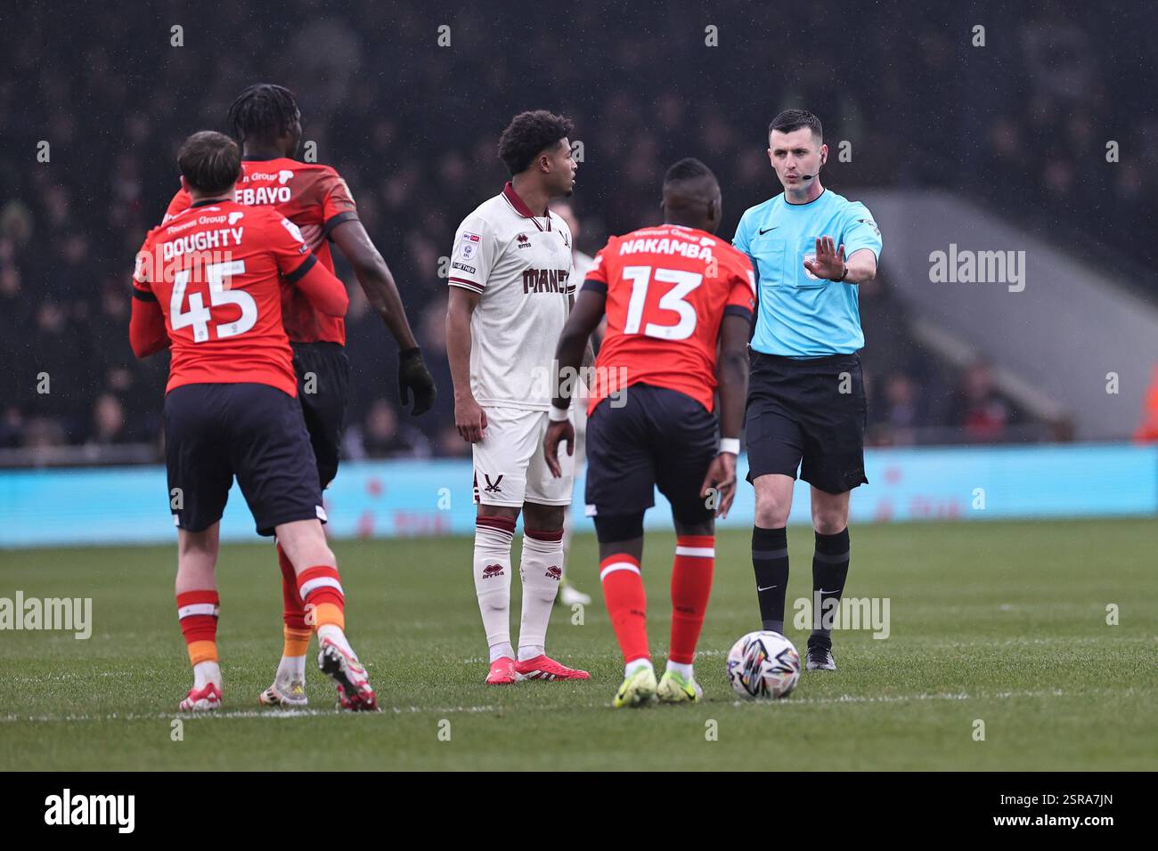 Luton, UK. 15th Feb, 2025. Match referee Lewis Smith gestures during ...