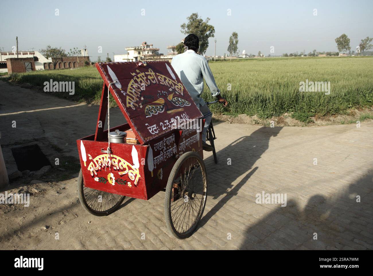 Hawker selling ice cream on his bicycle in Doulo Nangal village near ...