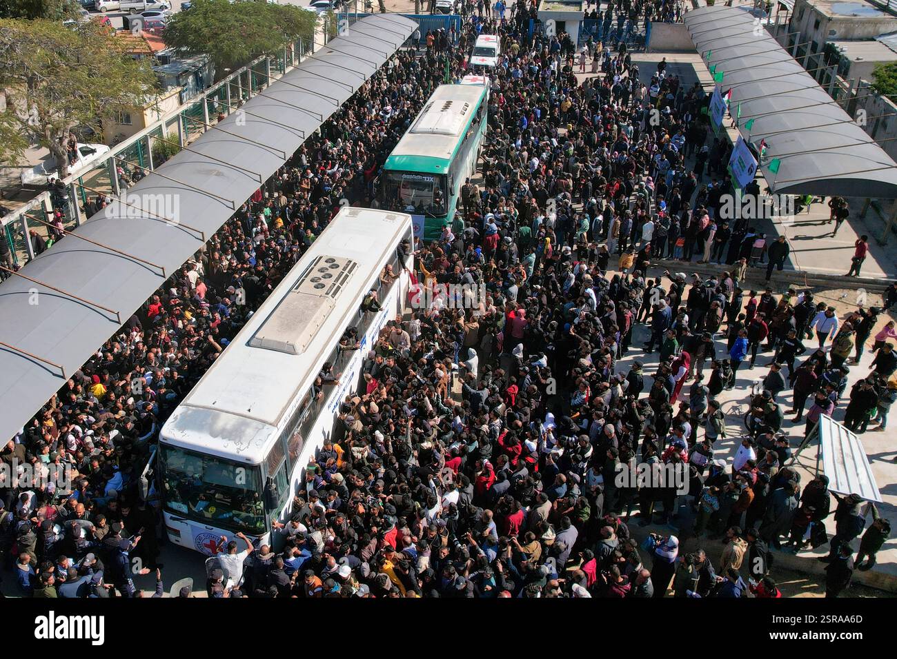 A crowd surrounds the buses carrying freed Palestinian prisoners as ...