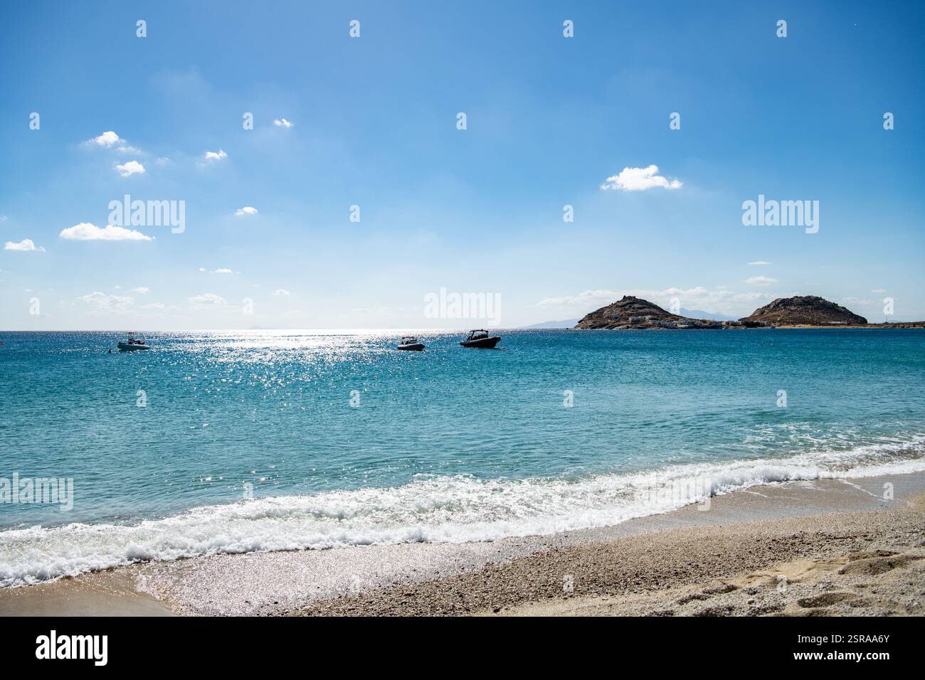 Seascape at Mykonos, Greece. Sunny day, clear blue water, cliffs and ...