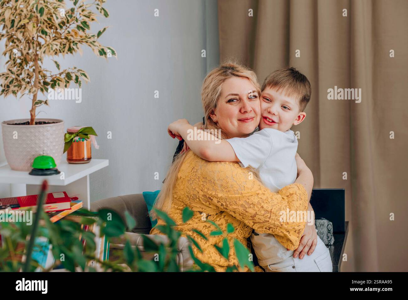 mother embracing her son with warmth in a cozy home environment concept ...