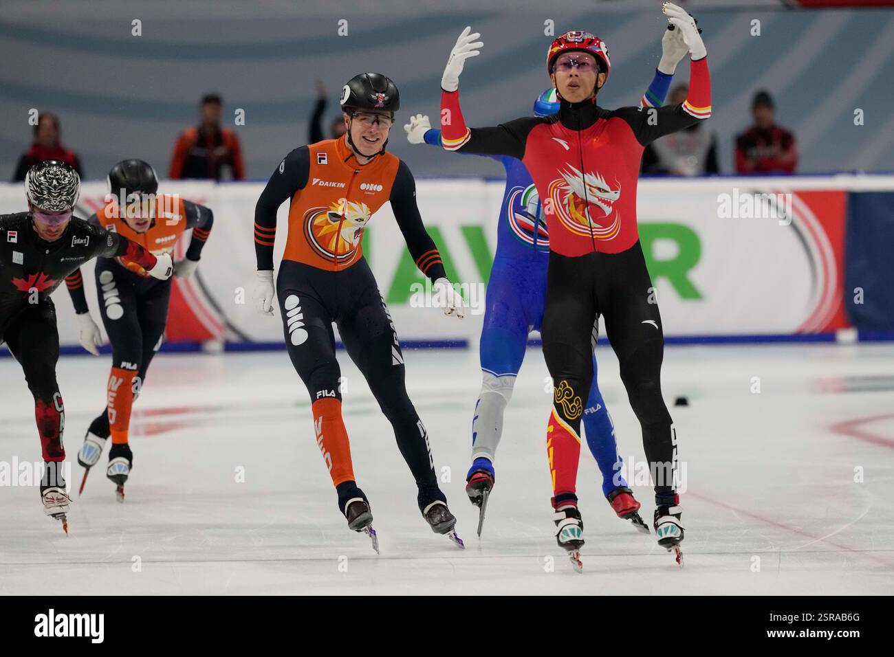 China's Long Sun, front, crosses the finish line and celebrates winning ...