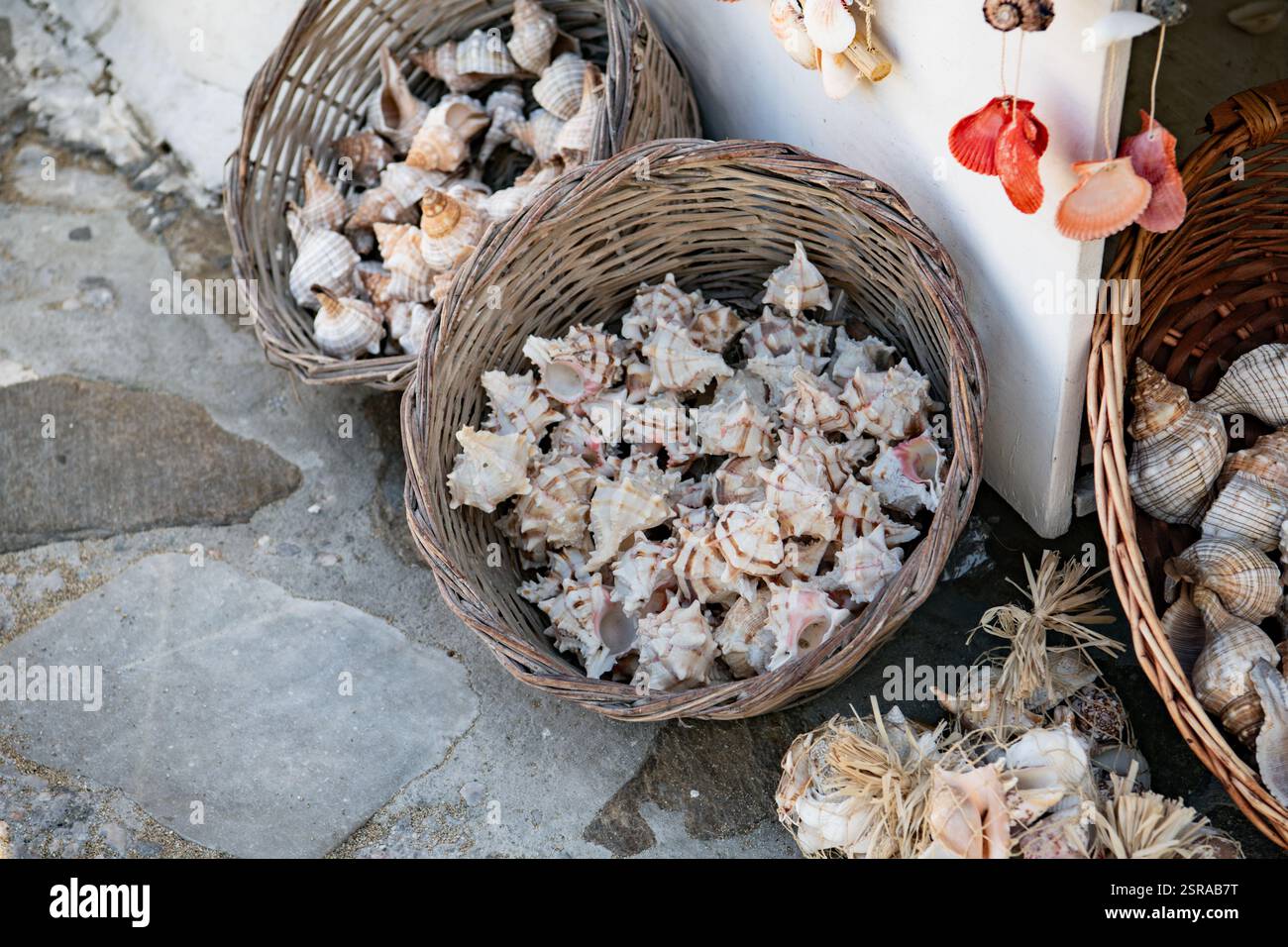 Seashells in wickler baskets on the beach in Greece Stock Photo - Alamy