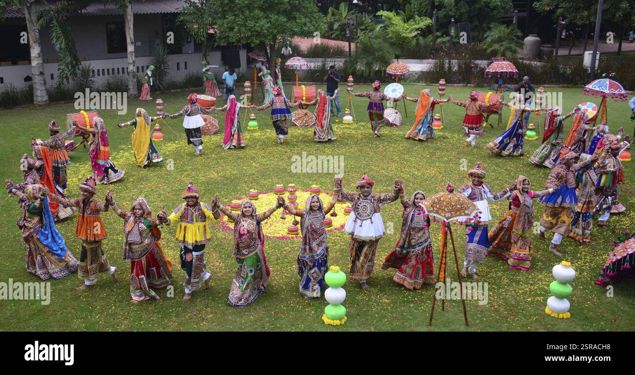 Girls in traditional attire, practice the Garba dance steps in ...