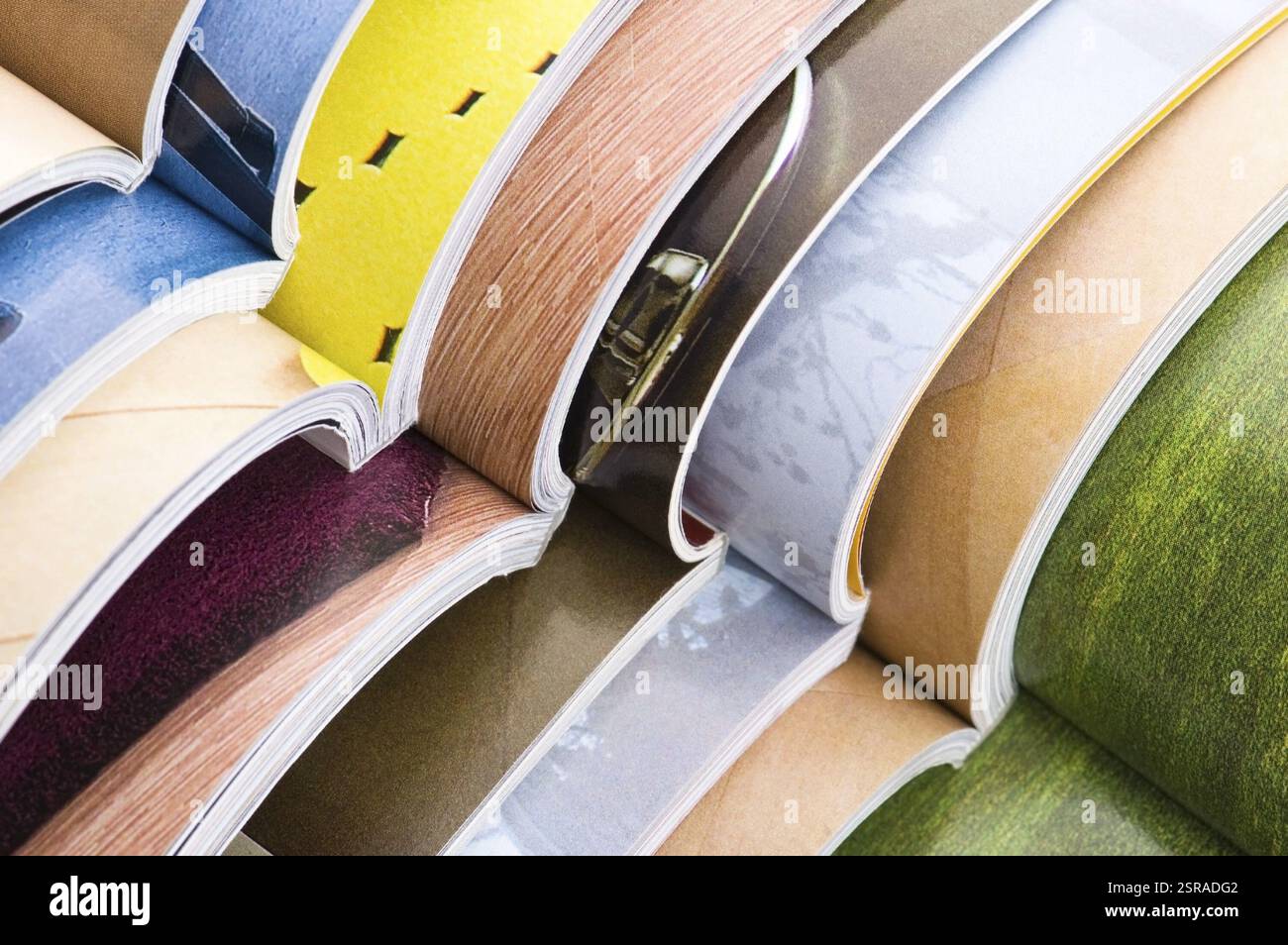 Stack of open magazines Stock Photo - Alamy