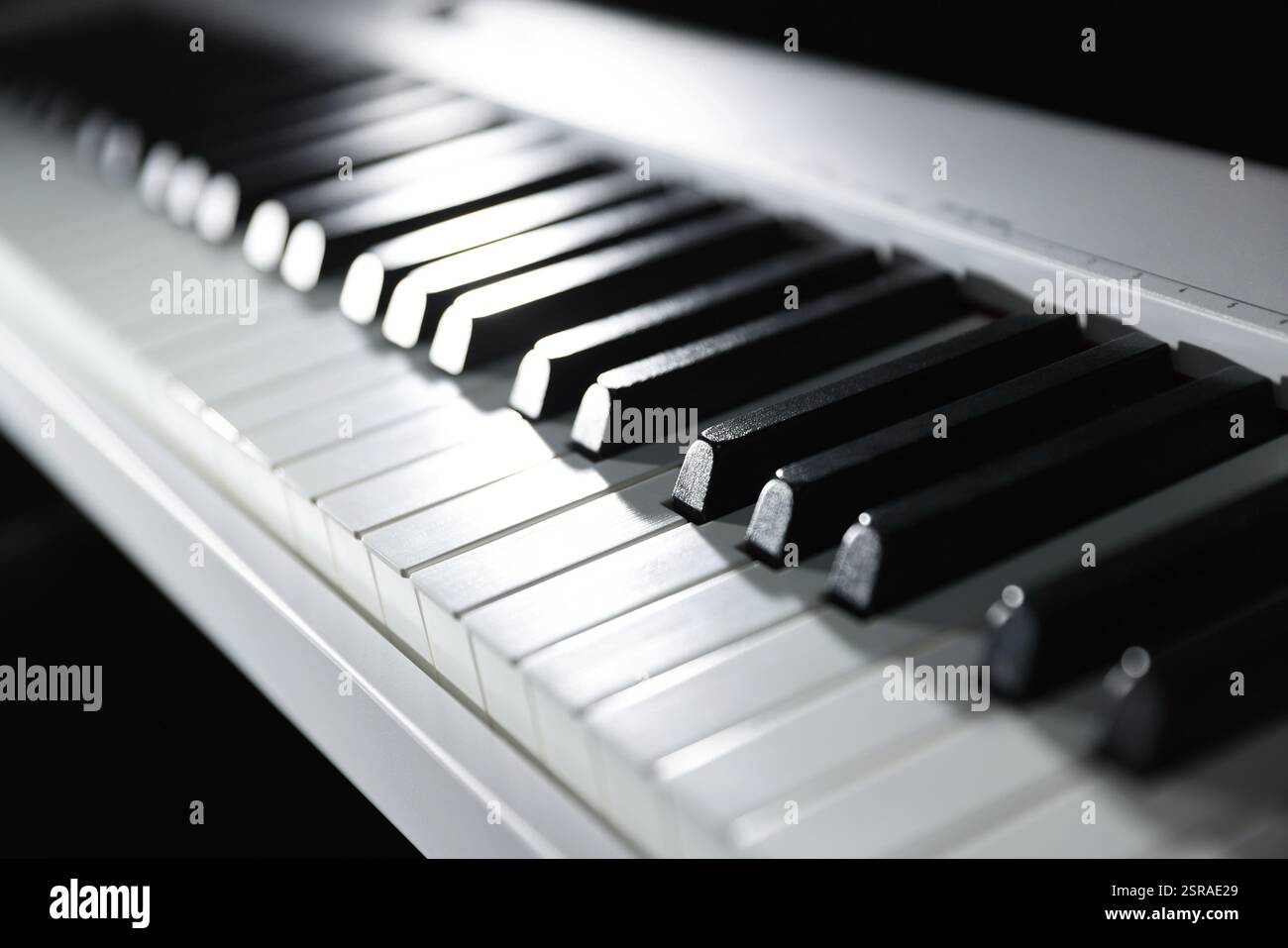 Synthesizer on black background, closeup. Electronic musical instrument ...