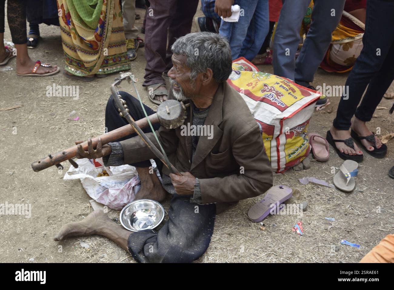 Beggar playing Ektara musical instrument, Holi Festival, Goligadh ...