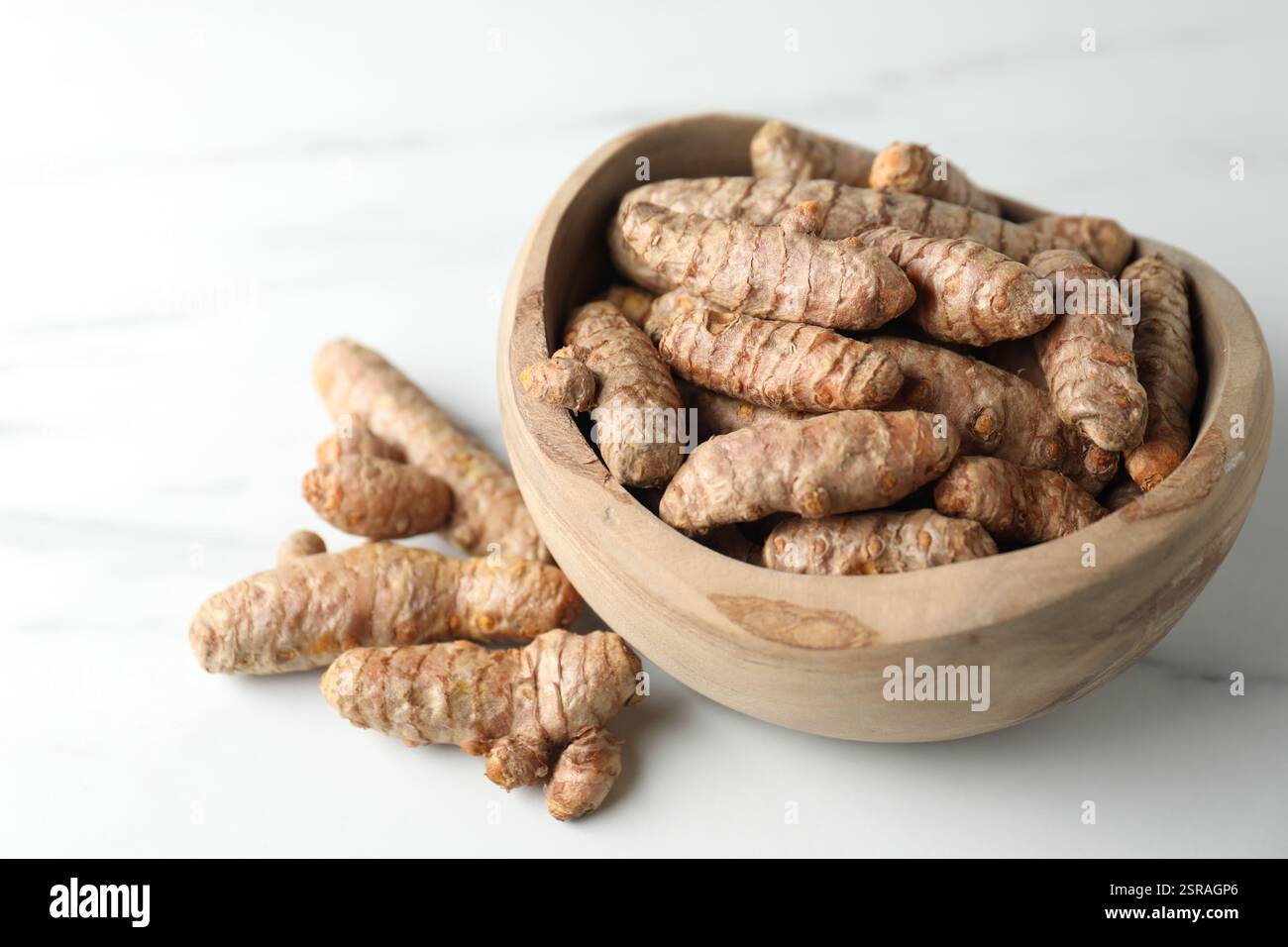 Whole turmeric in bowl hi-res stock photography and images - Alamy