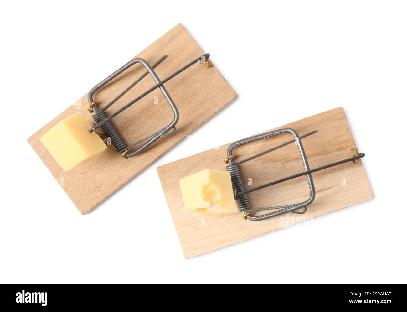 Two spring-loaded bar mousetraps with pieces of cheese isolated on ...