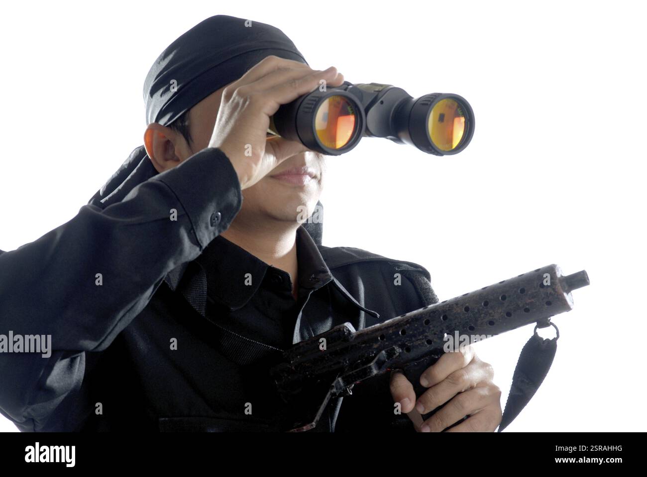 Commando seeing through binocular with gun MR#782W Stock Photo - Alamy