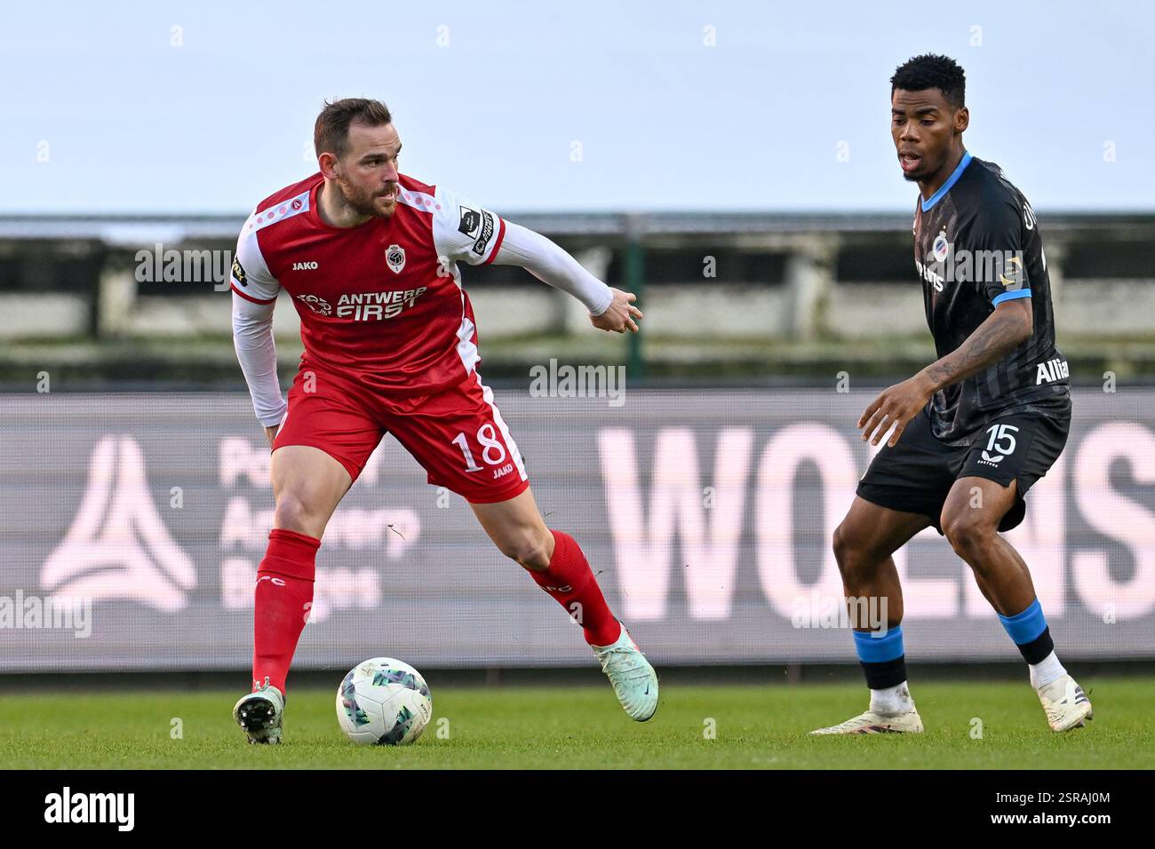 Vincent Janssen (18) of Antwerp and Raphael Onyedika (15) of Club ...