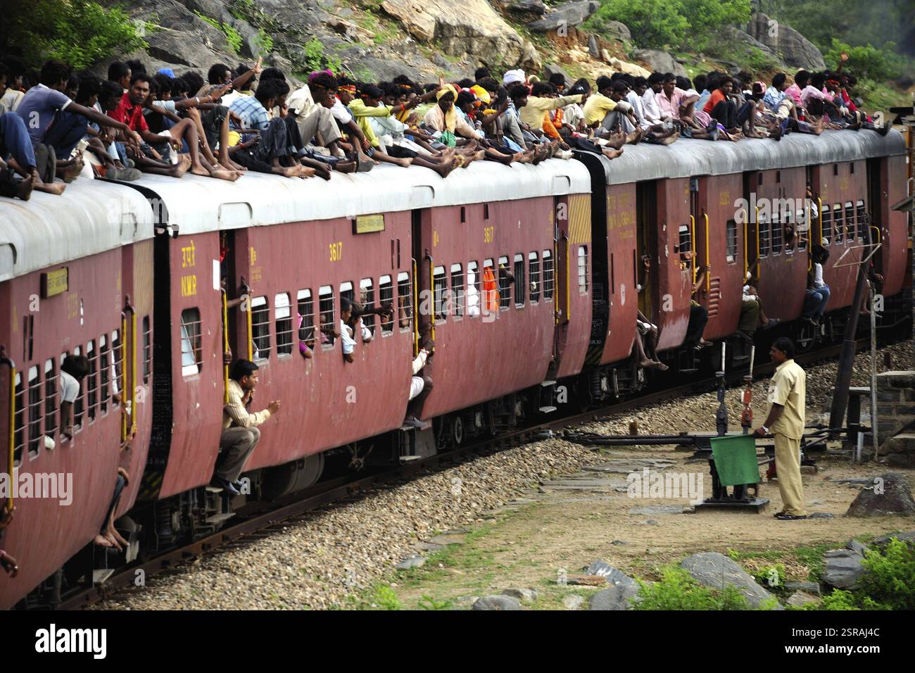 Commuters sitting on roof of train, Kamali Ghat, Rajasthan, India, Asia ...