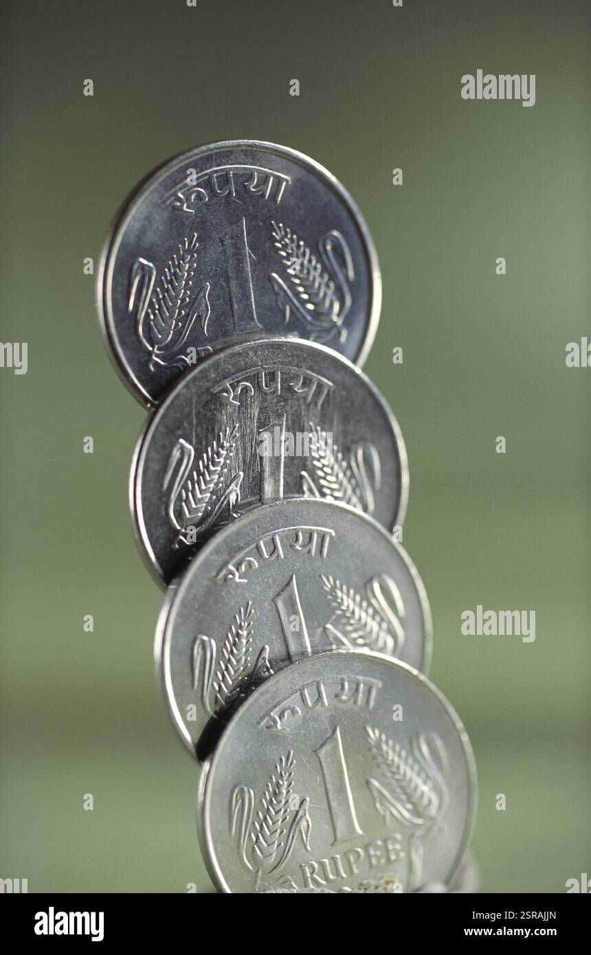 Concept, growth Indian one rupees coins on green background Stock Photo ...