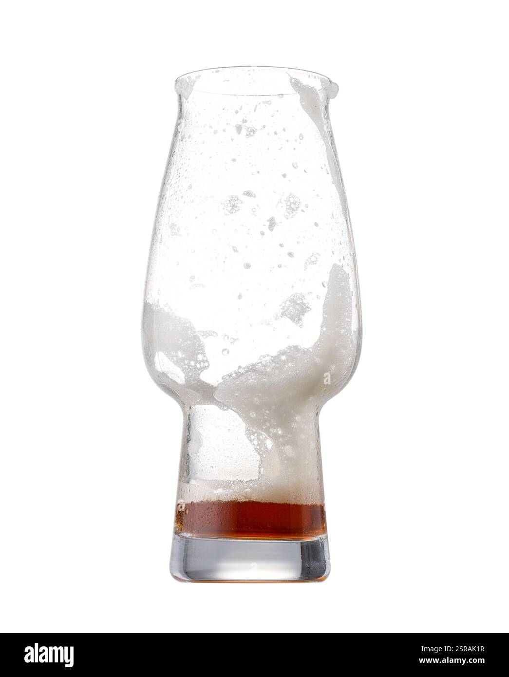 Almost empty glass of beer isolated on white Stock Photo - Alamy