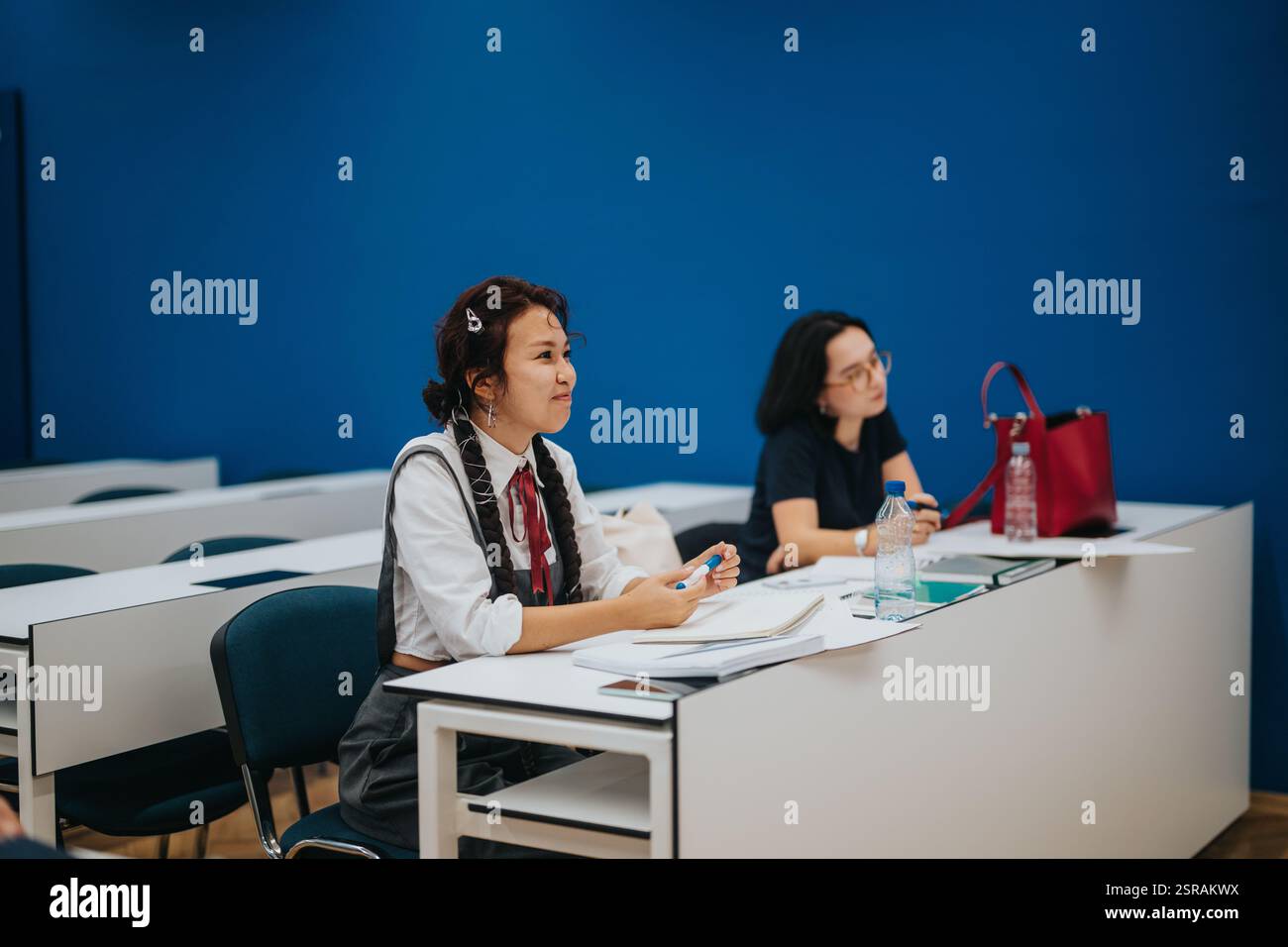 Students attentively listening during a classroom lecture session Stock ...