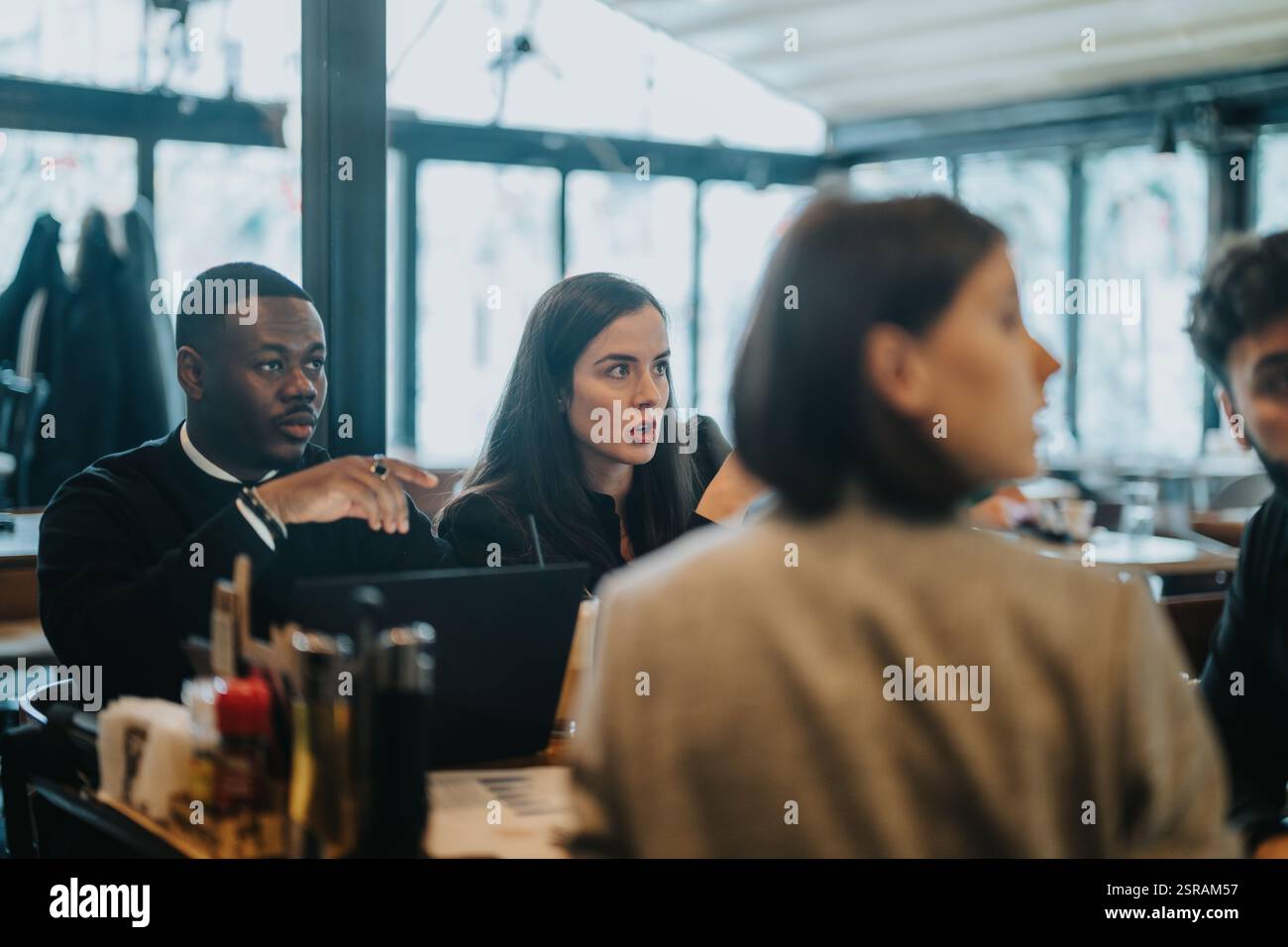 Collaborative Group Discussing Business Strategies in an Informal ...