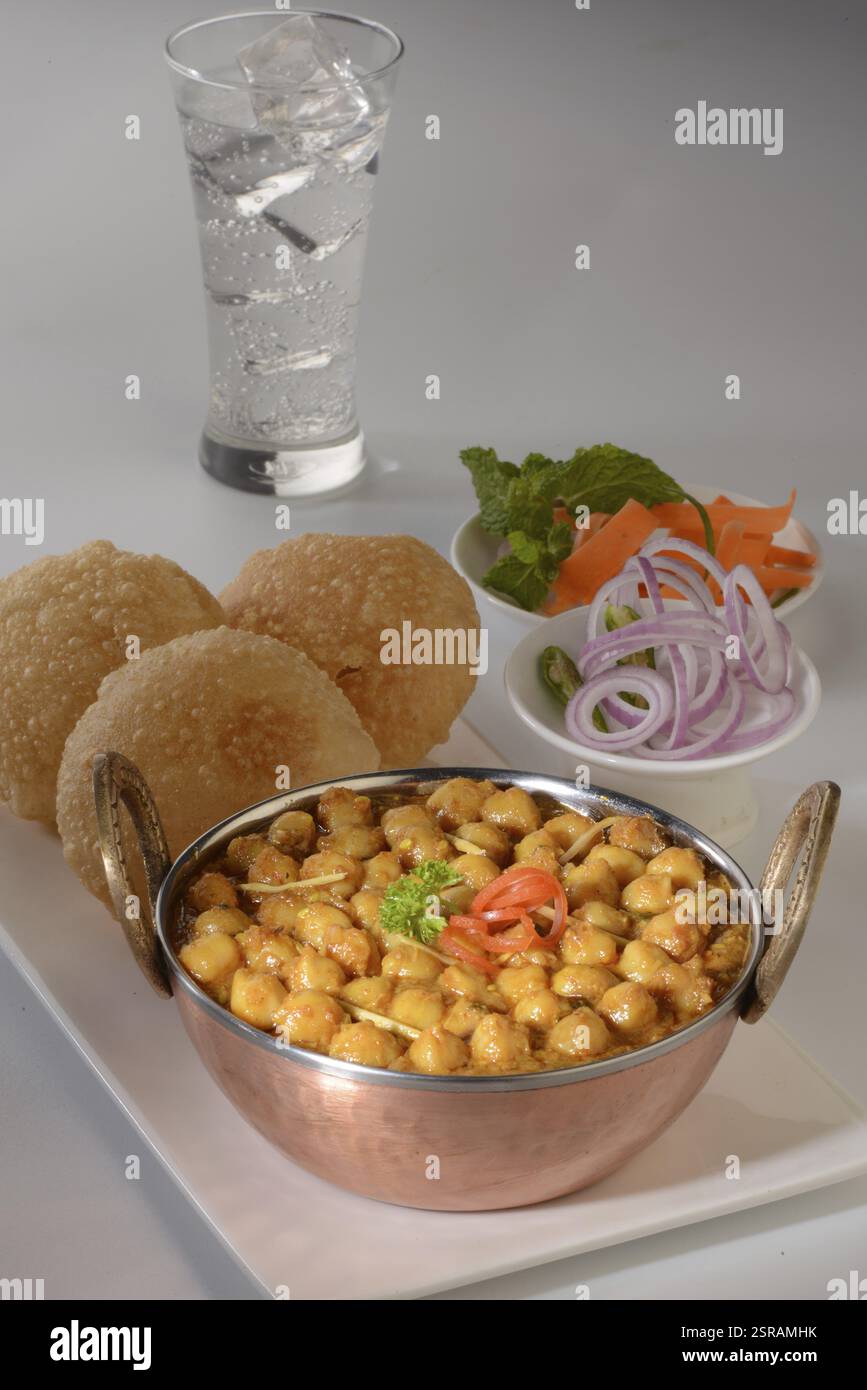 Chhole Puree served in Kadhai and plate, India, Asia Stock Photo - Alamy