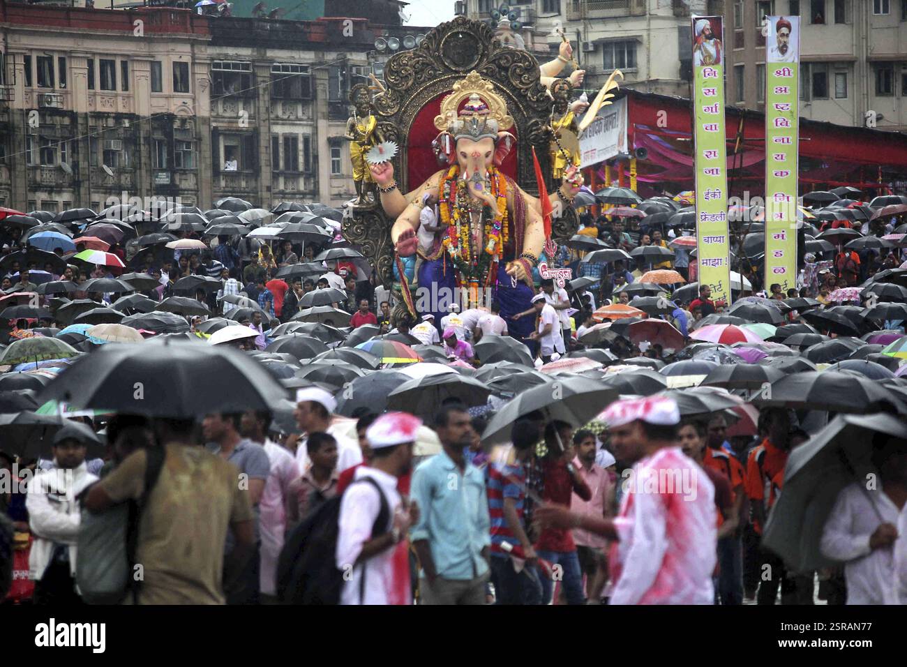 A gigantic idol of Hindu elephant-headed god Ganesh, being led to the ...