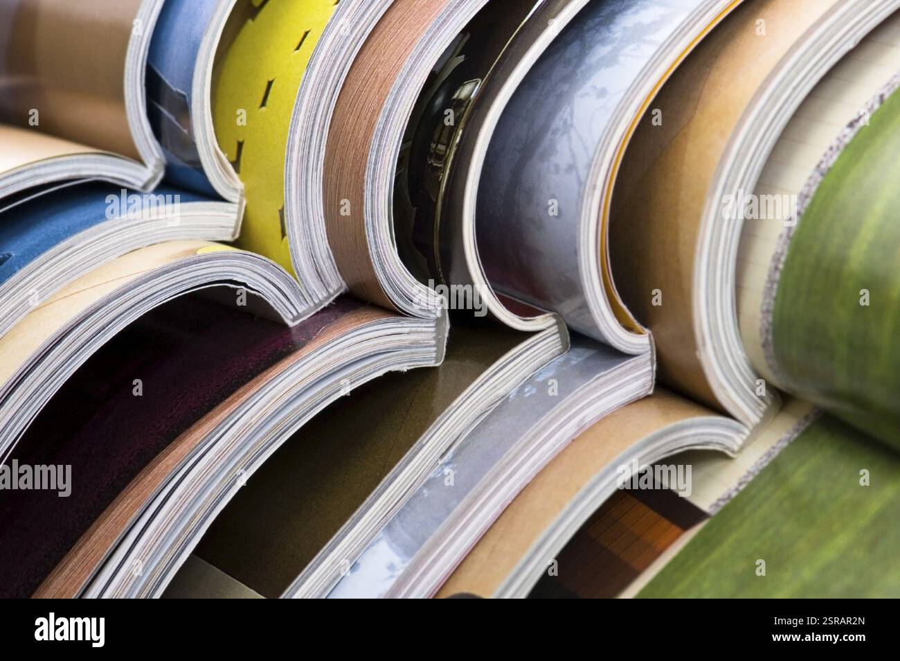 Stack of open magazines Stock Photo - Alamy