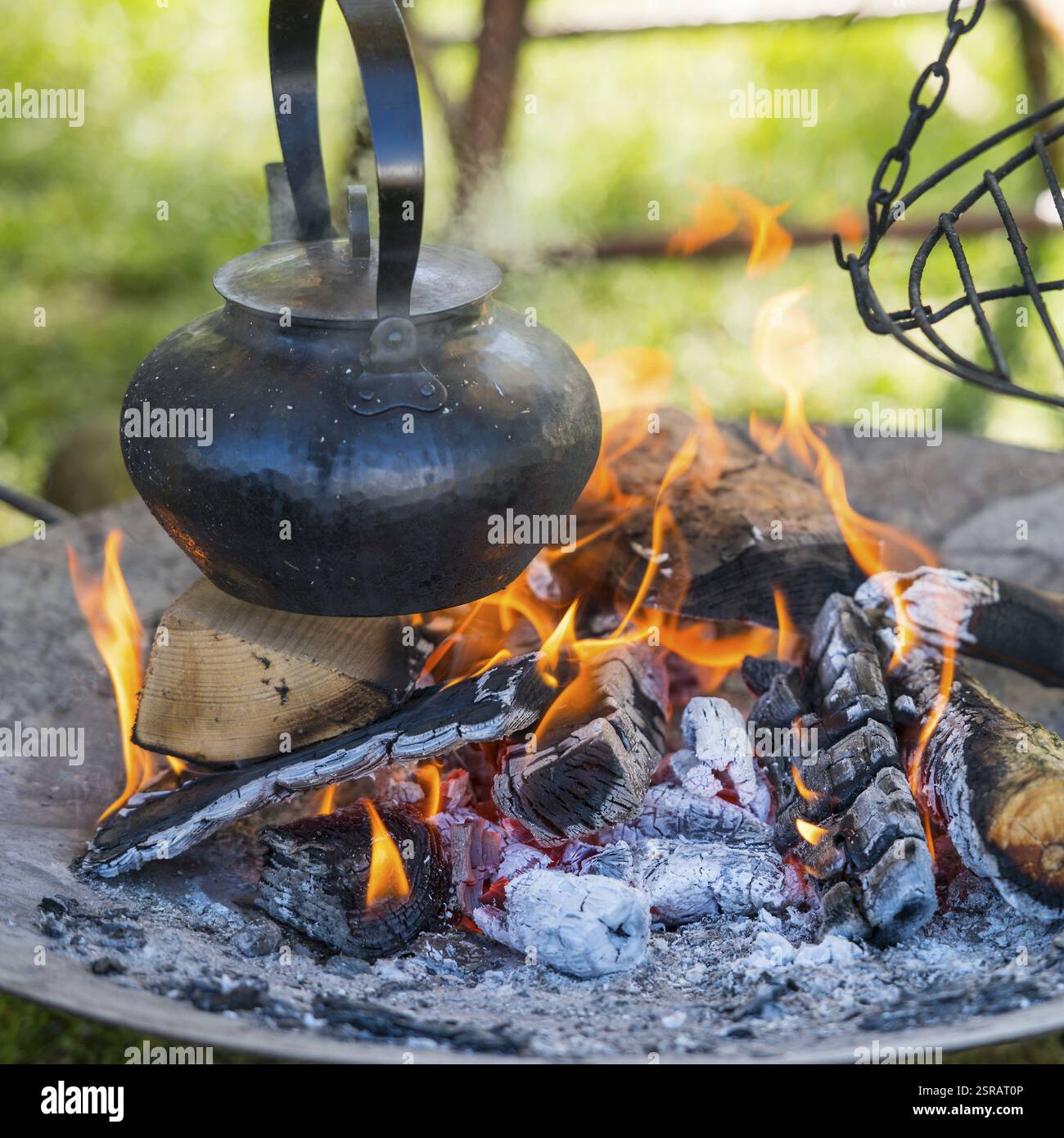 Boiling over the fire Stock Photo - Alamy