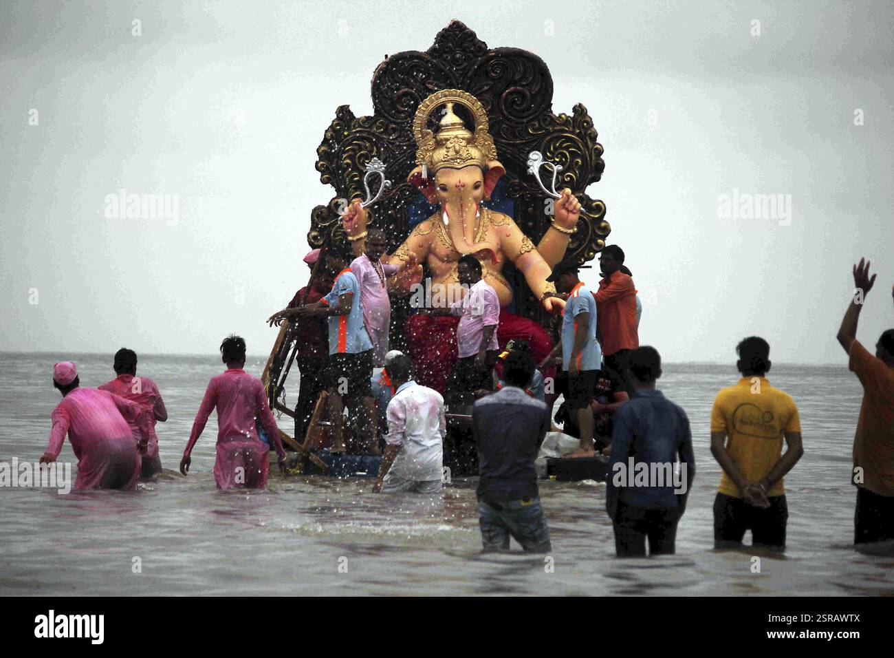A gigantic idol of Hindu elephant-headed god Ganesh, being led to the ...