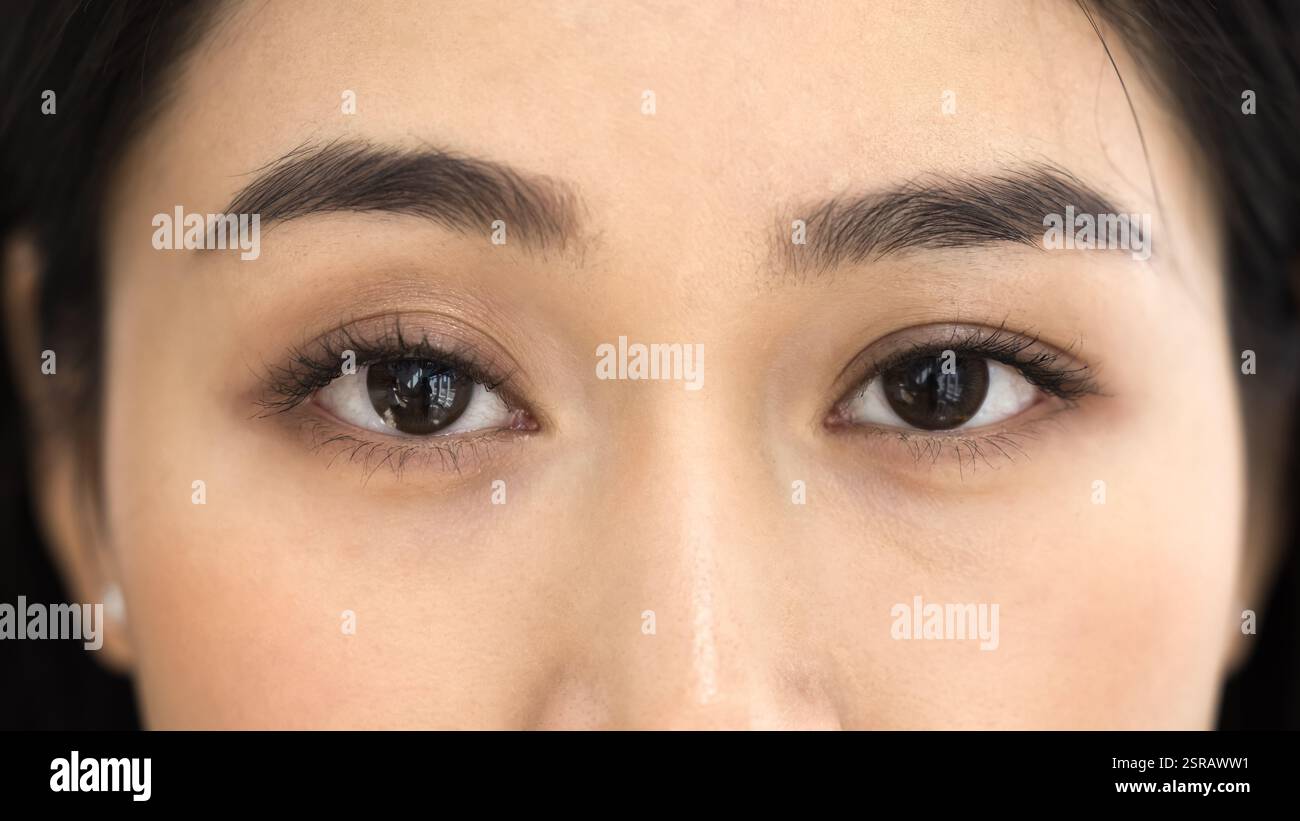 Close-up upper face view of young Asian woman Stock Photo - Alamy