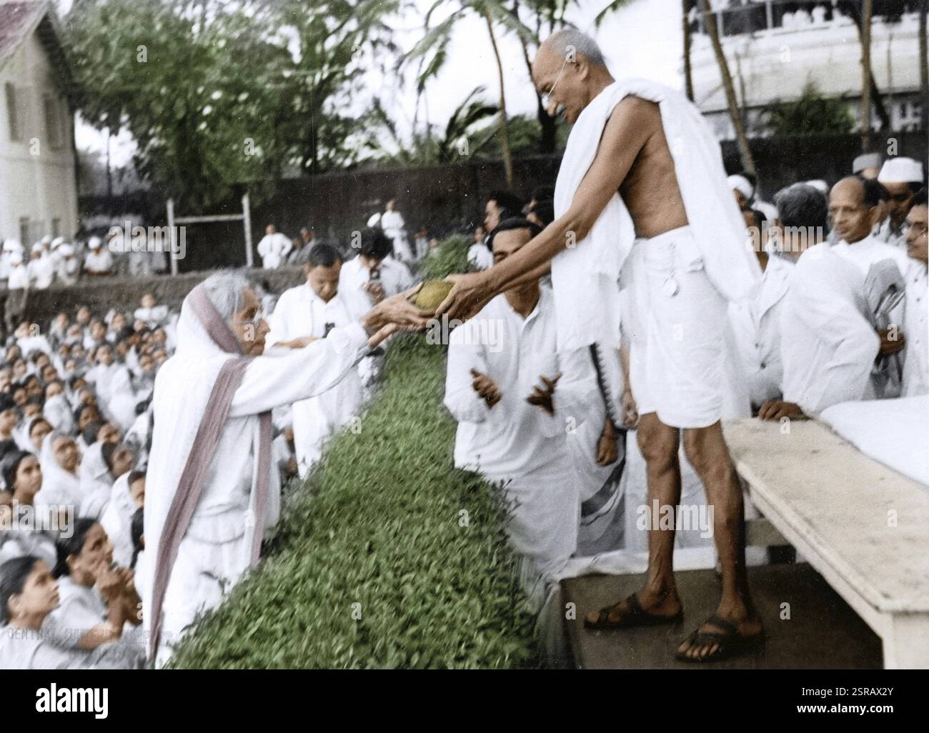 Mahatma Gandhi taking coconut before evening prayer meeting, Mumbai ...