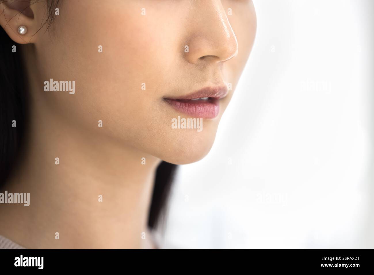 Close up shot of young beautiful Asian womans lower face Stock Photo ...