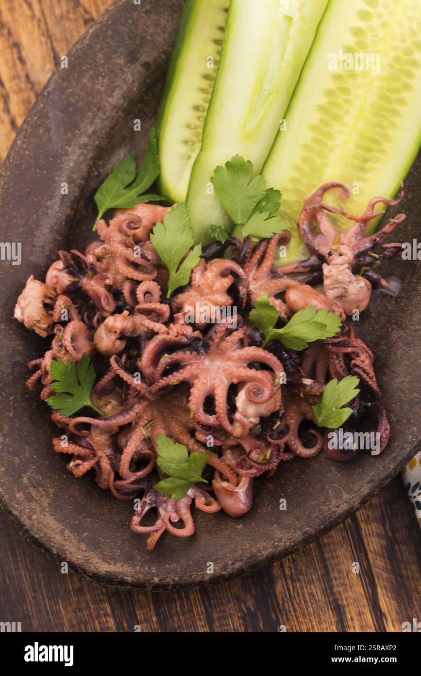 Octopus. Greek, eating Stock Photo - Alamy