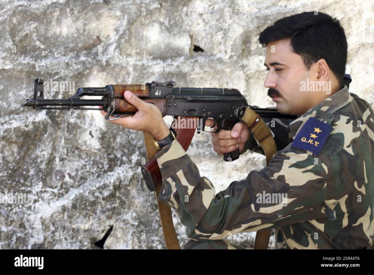 Black Cat commando with an AK 47 light machine gun MR#725 Stock Photo ...