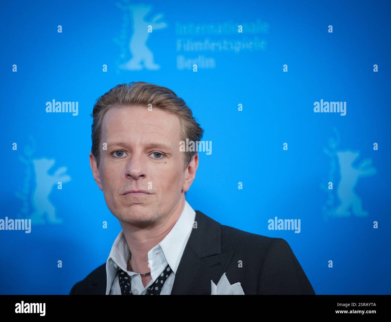 Berlin, Germany. 15th Feb, 2025. Actor Alexander Scheer stands in front ...