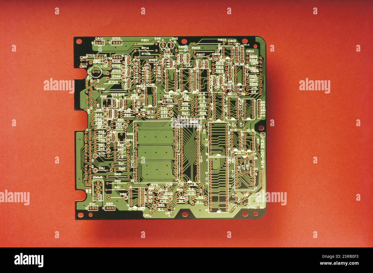 Electronics printed circuit PCB on red background Stock Photo - Alamy